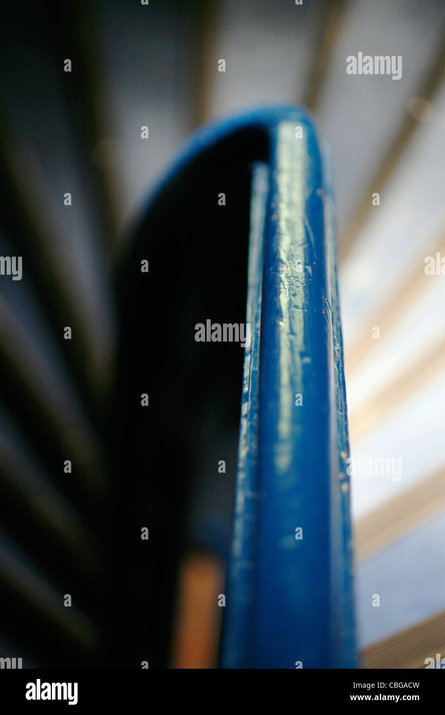 Blue handrail surrounded by spiral staircase Stock Photo - Alamy