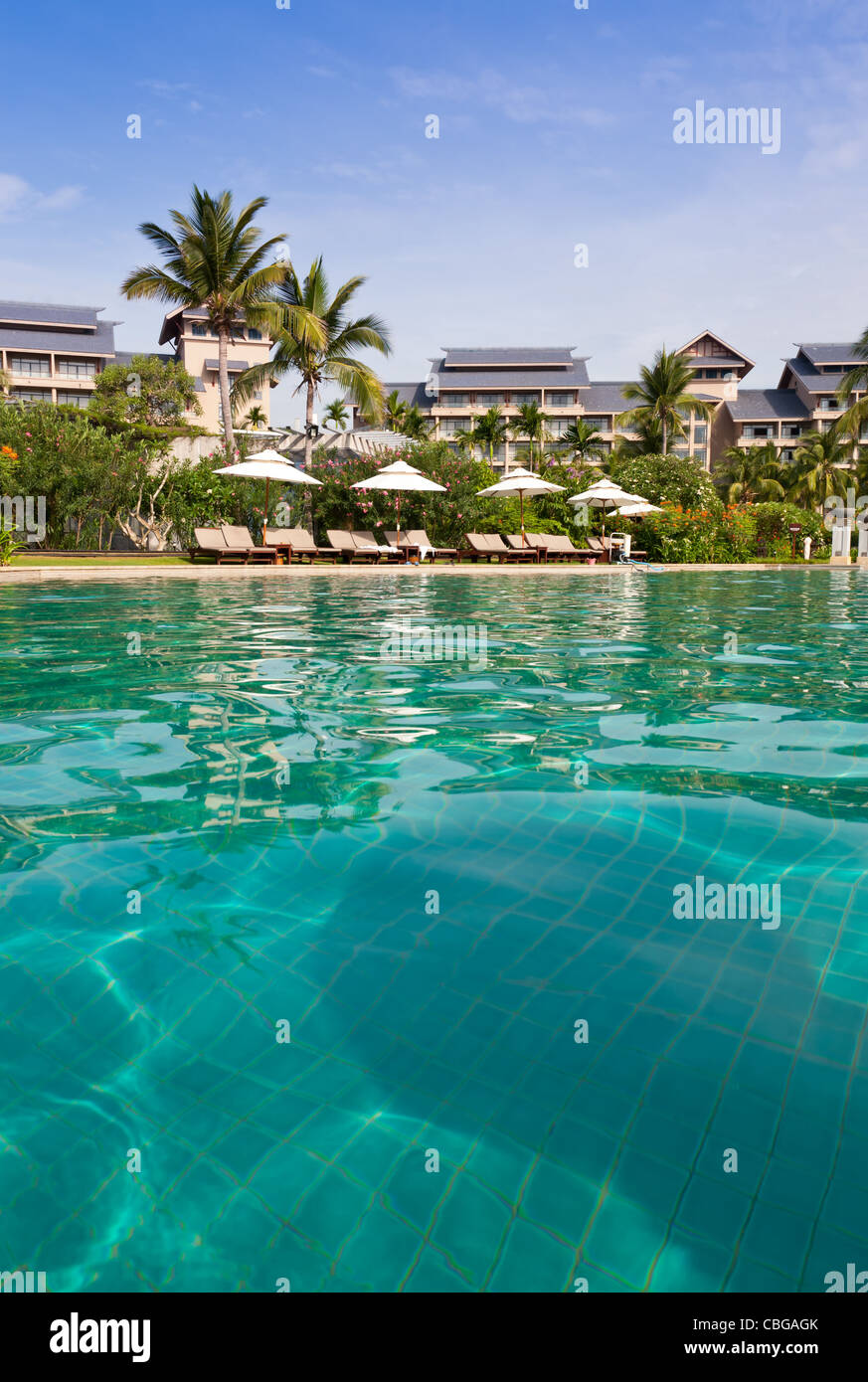 Beautiful swimming pool at hotel garden Stock Photo - Alamy