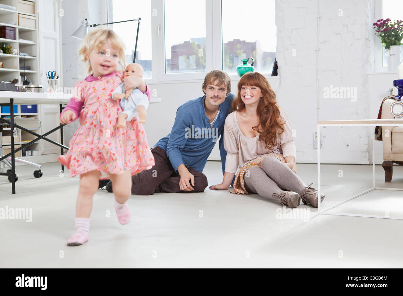Parents watching baby on floor hi-res stock photography and images - Alamy