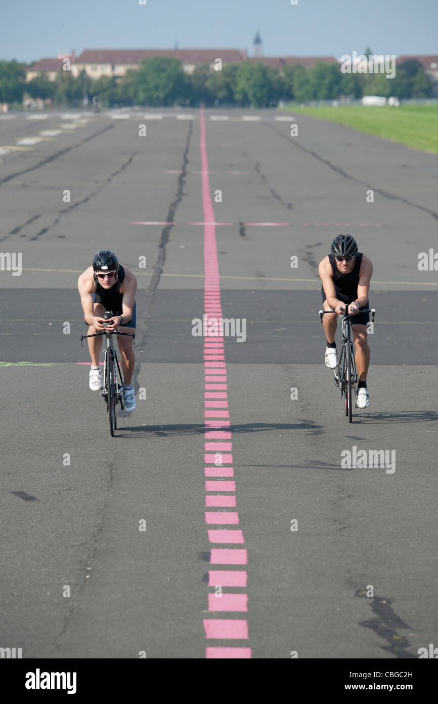 Two cyclists on racing bicycles, front view Stock Photo - Alamy