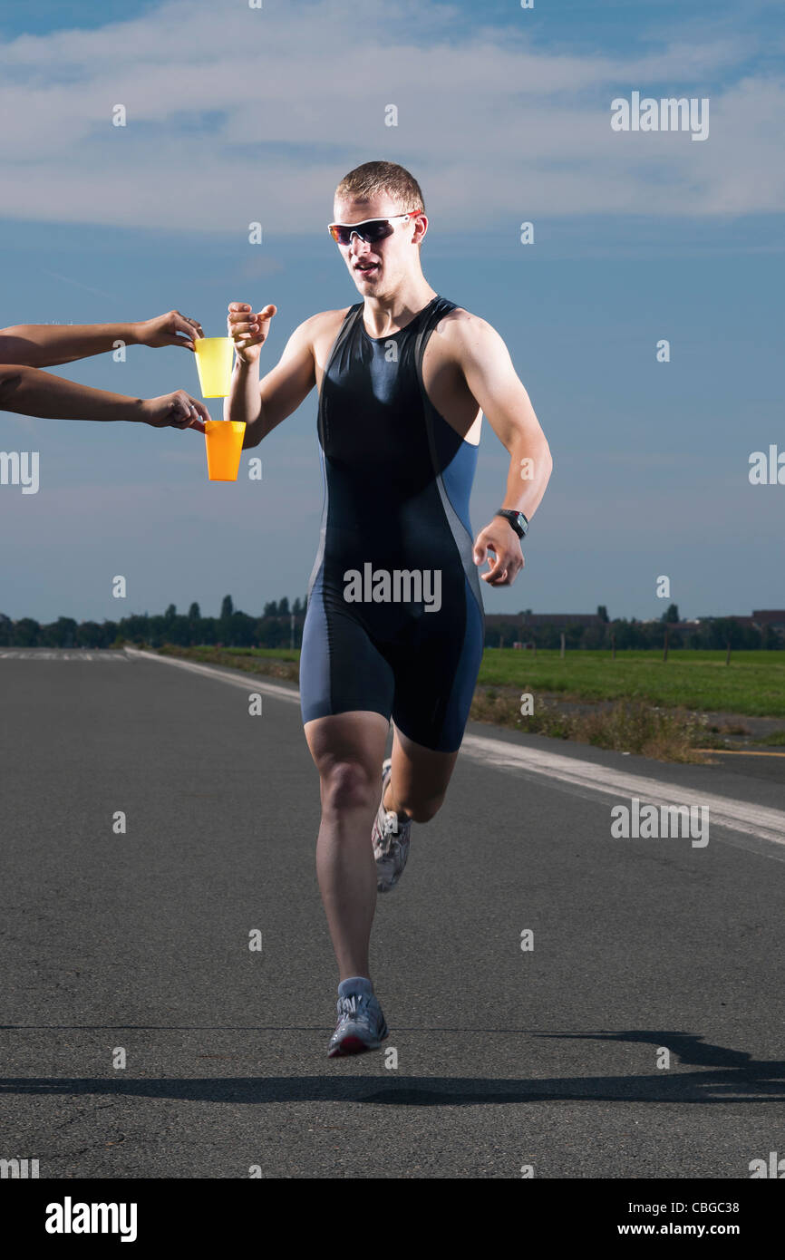 Athlete people handing out water hi-res stock photography and images ...