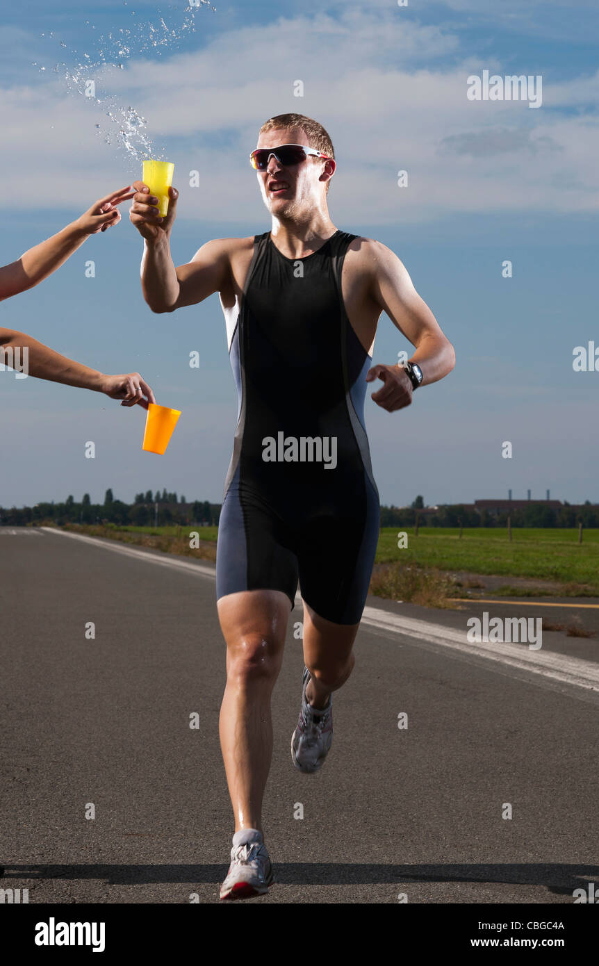 Handing out drinking water hi-res stock photography and images - Alamy