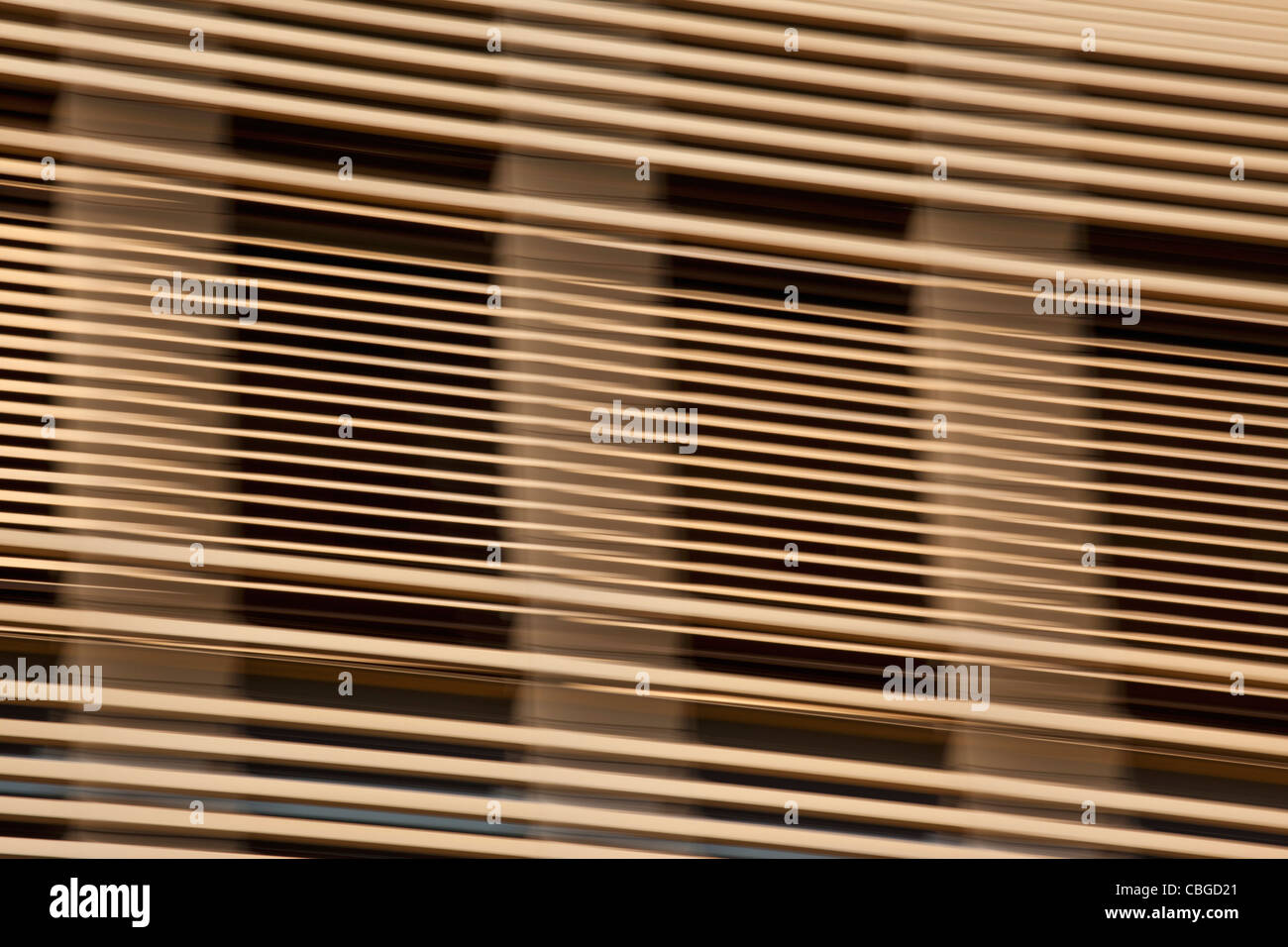 Louvered wooden slats in front of window Stock Photo - Alamy