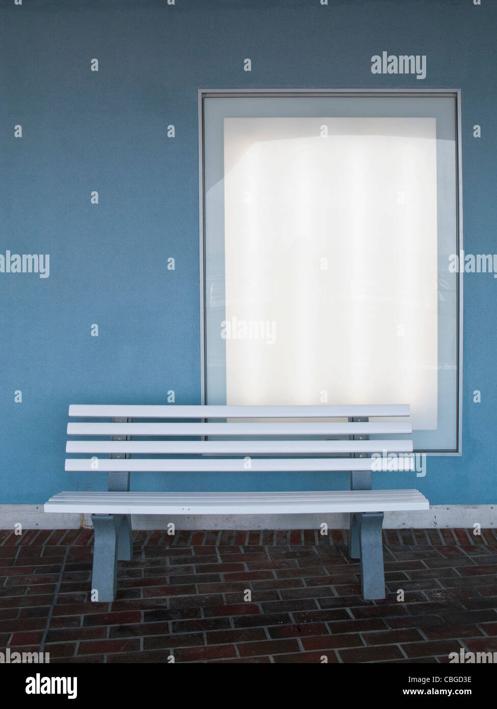 Empty bench on tiled floor in front of window Stock Photo - Alamy
