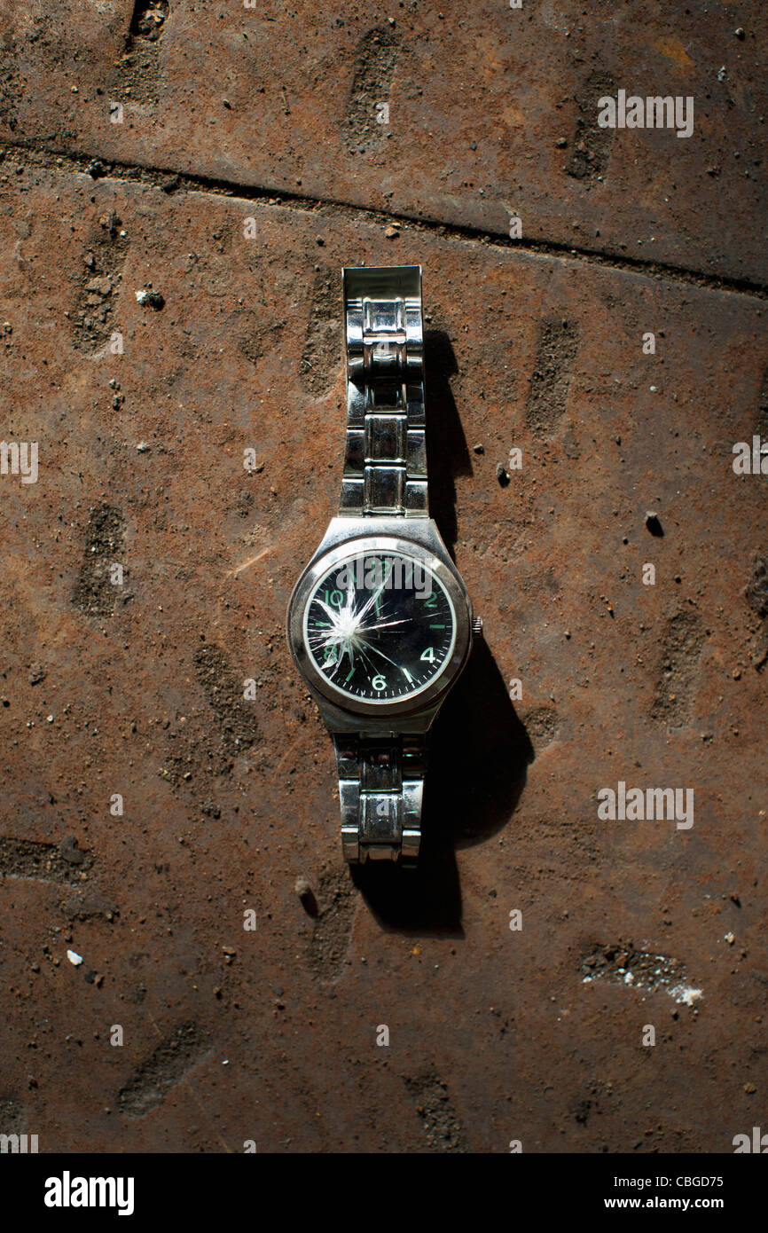 Broken wristwatch on concrete Stock Photo - Alamy