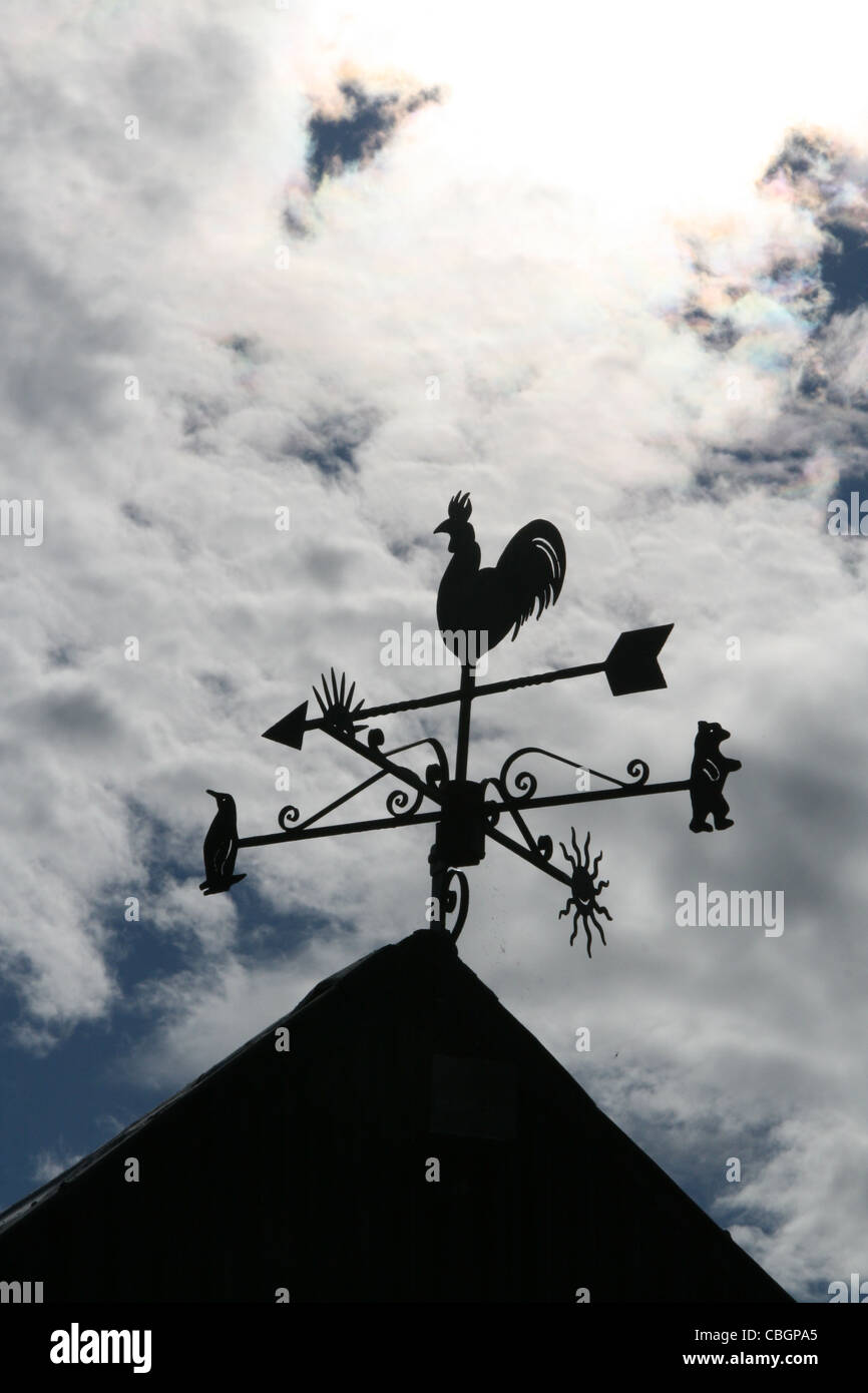 compass weather vain on roof top Stock Photo - Alamy