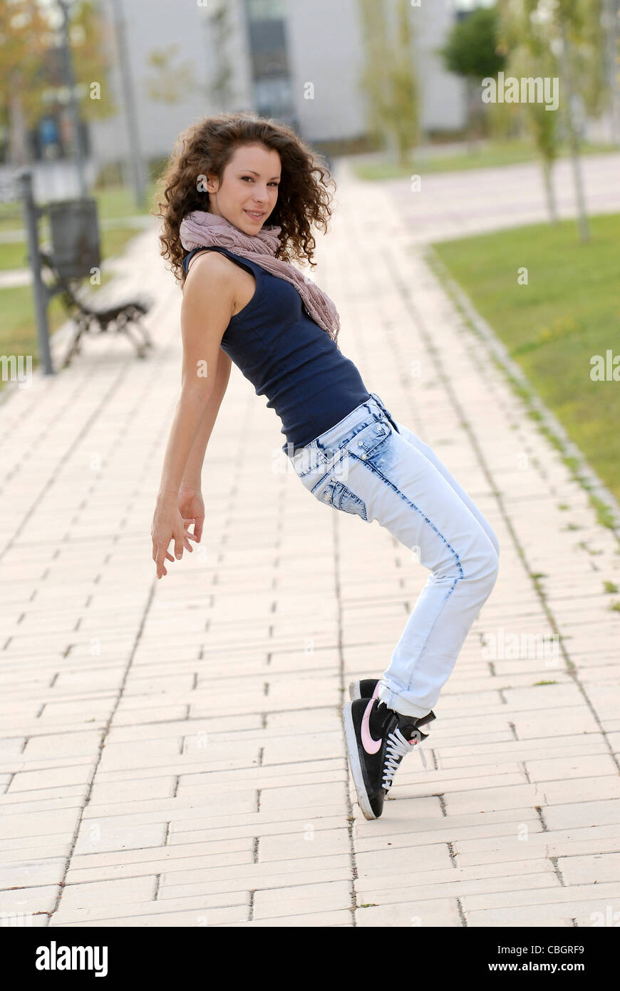 Cute teen dancer doing a street dance movement Stock Photo - Alamy