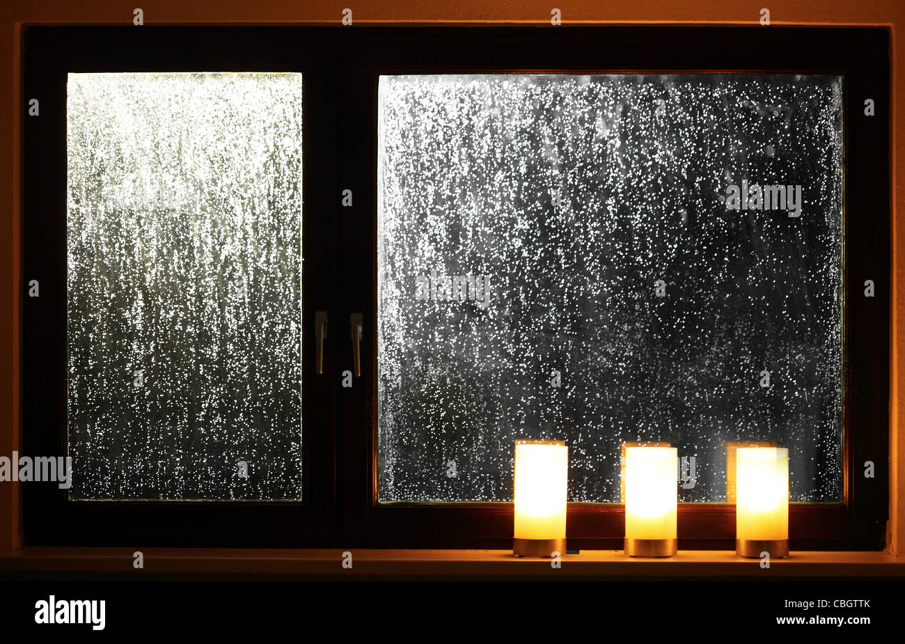 View from inside a room towards the outside, during heavy rainfall ...