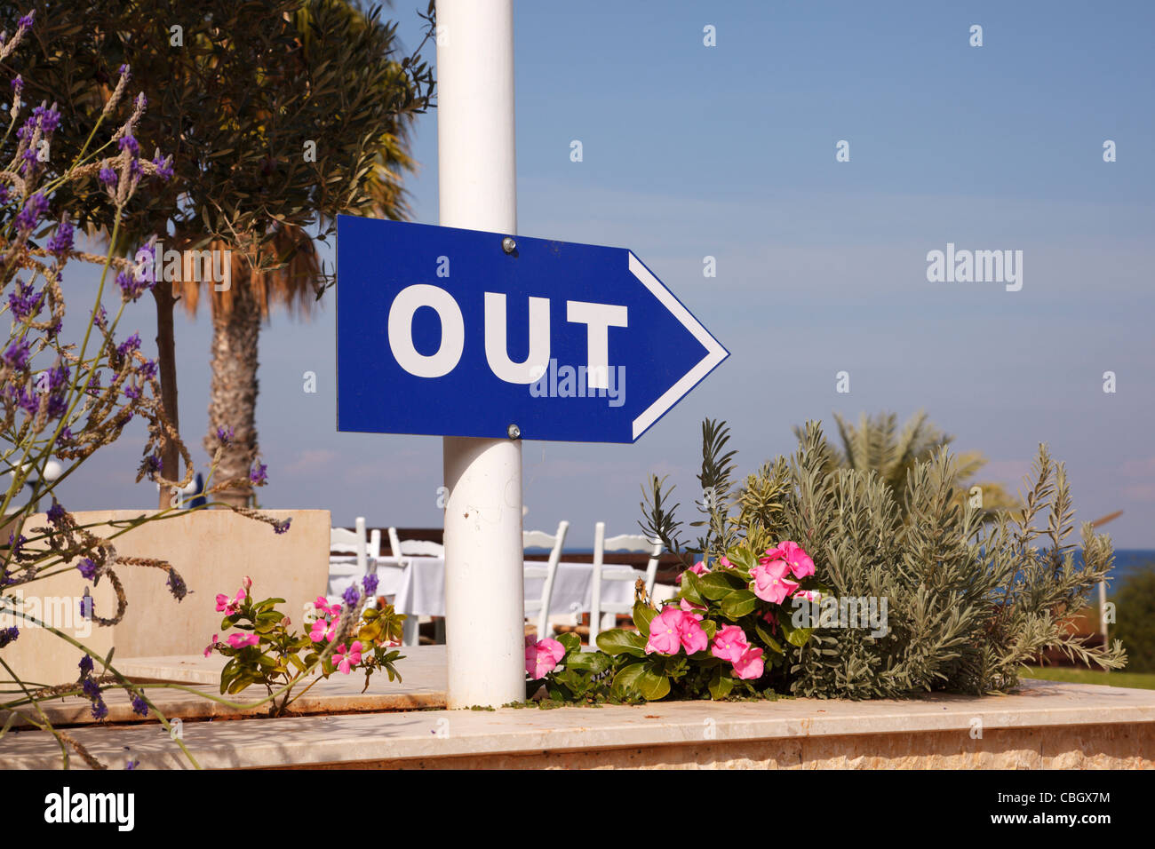 "Out" sign in tropical setting. Protarus, Cyprus Stock Photo - Alamy