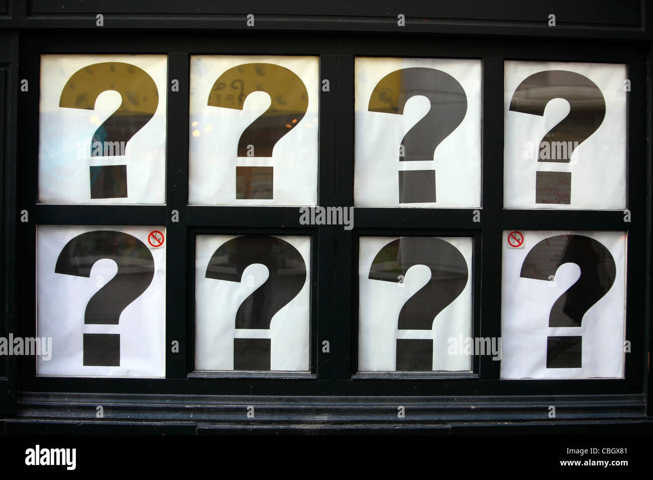 Closed shop. Shop window covered with question mark symbols. Antwerp ...