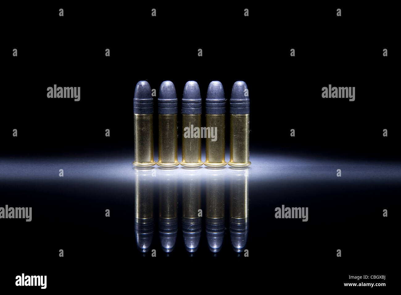 Several .22 caliber bullets on black background Stock Photo - Alamy