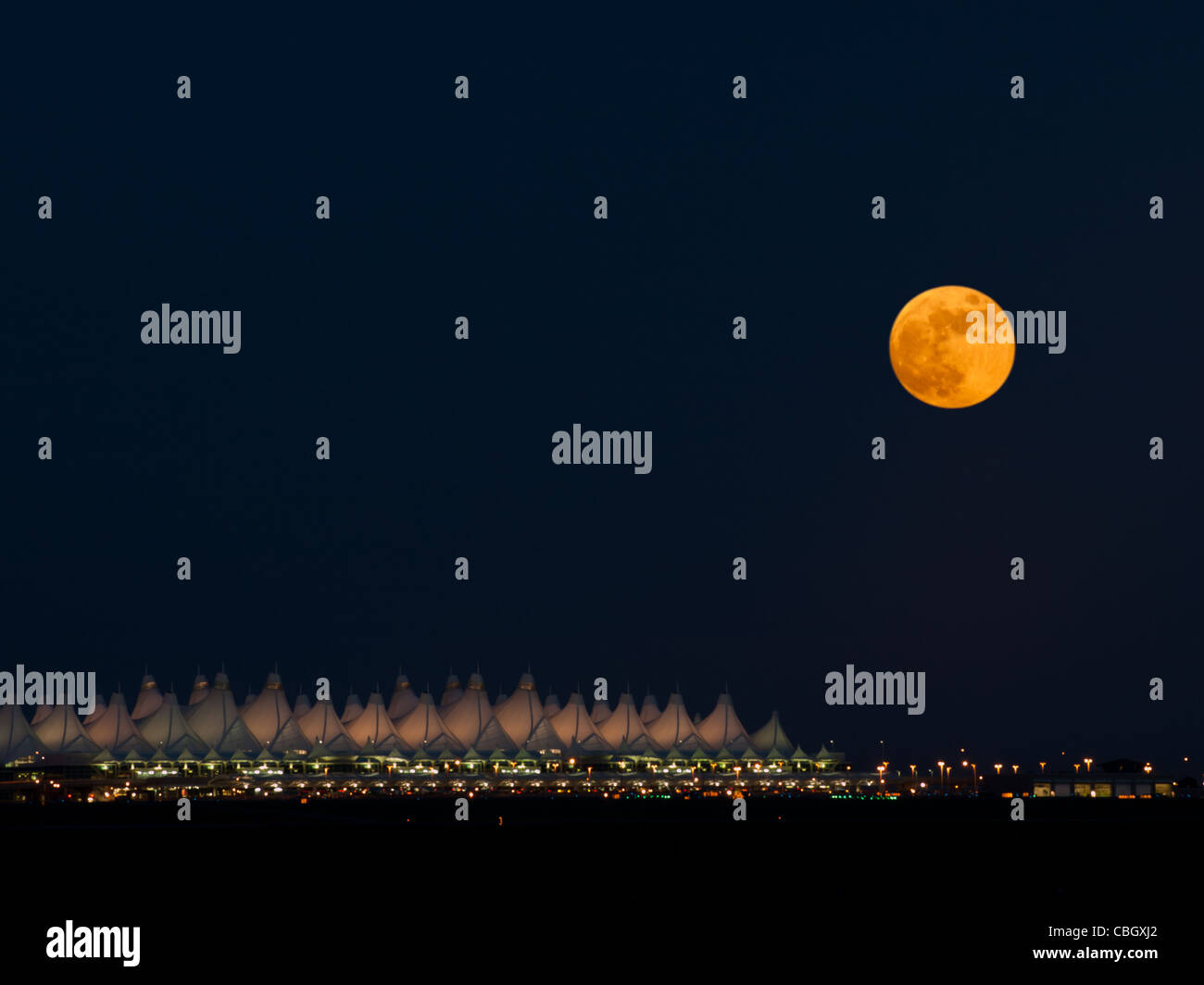 Full moon over the Denver International Airport in Colorado Stock Photo ...