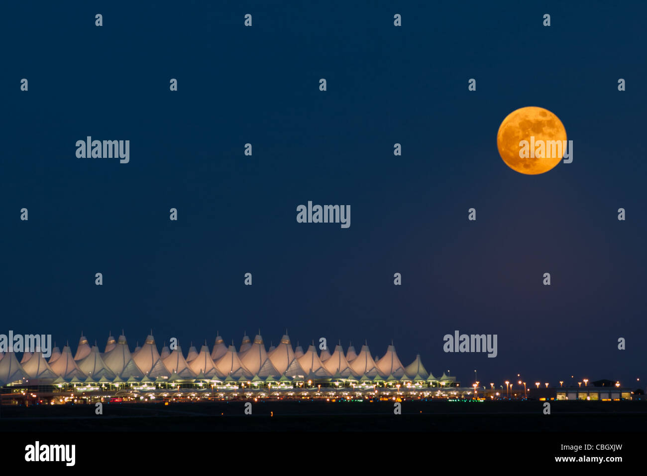 Full moon over the Denver International Airport in Colorado Stock Photo ...