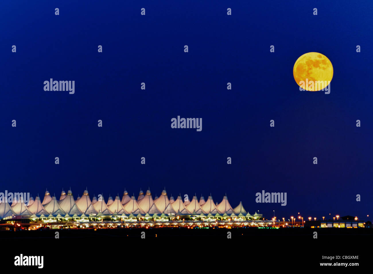Full moon over the Denver International Airport in Colorado Stock Photo ...