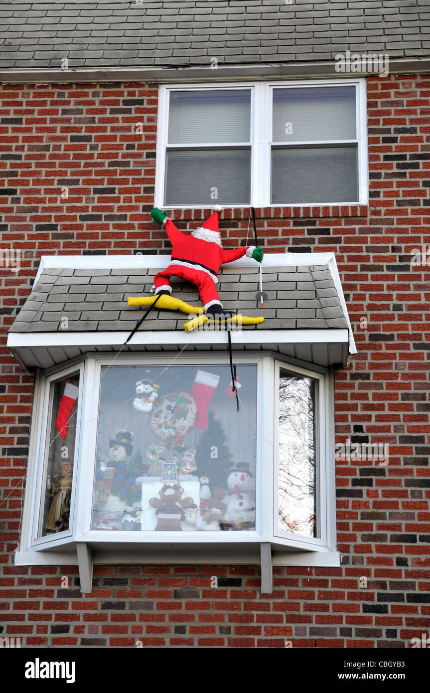 Santa Claus climb to window with Christmas gifts for kids Stock Photo ...