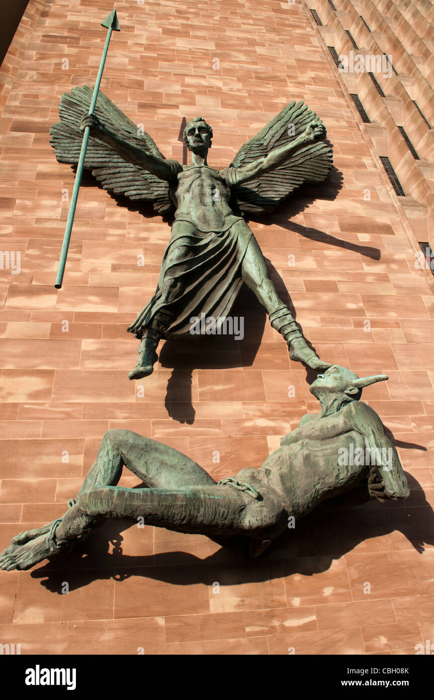 Bronze statues of St Michael and the Devil Stock Photo - Alamy