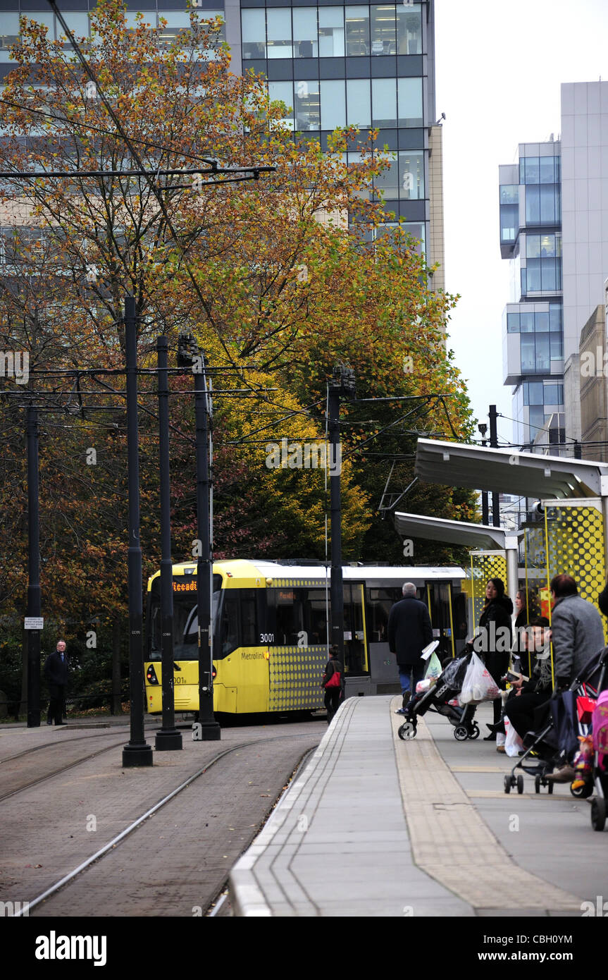 Yellow styled Metrolink tram, Manchester Stock Photo - Alamy