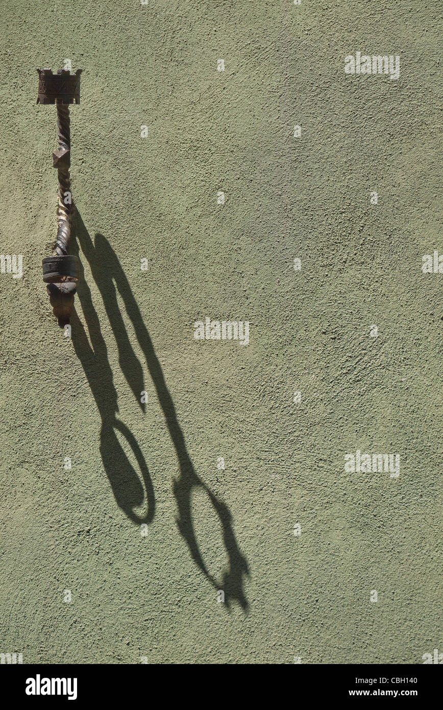 A decorative Italian wrought iron torch holder, that functioned as a ...