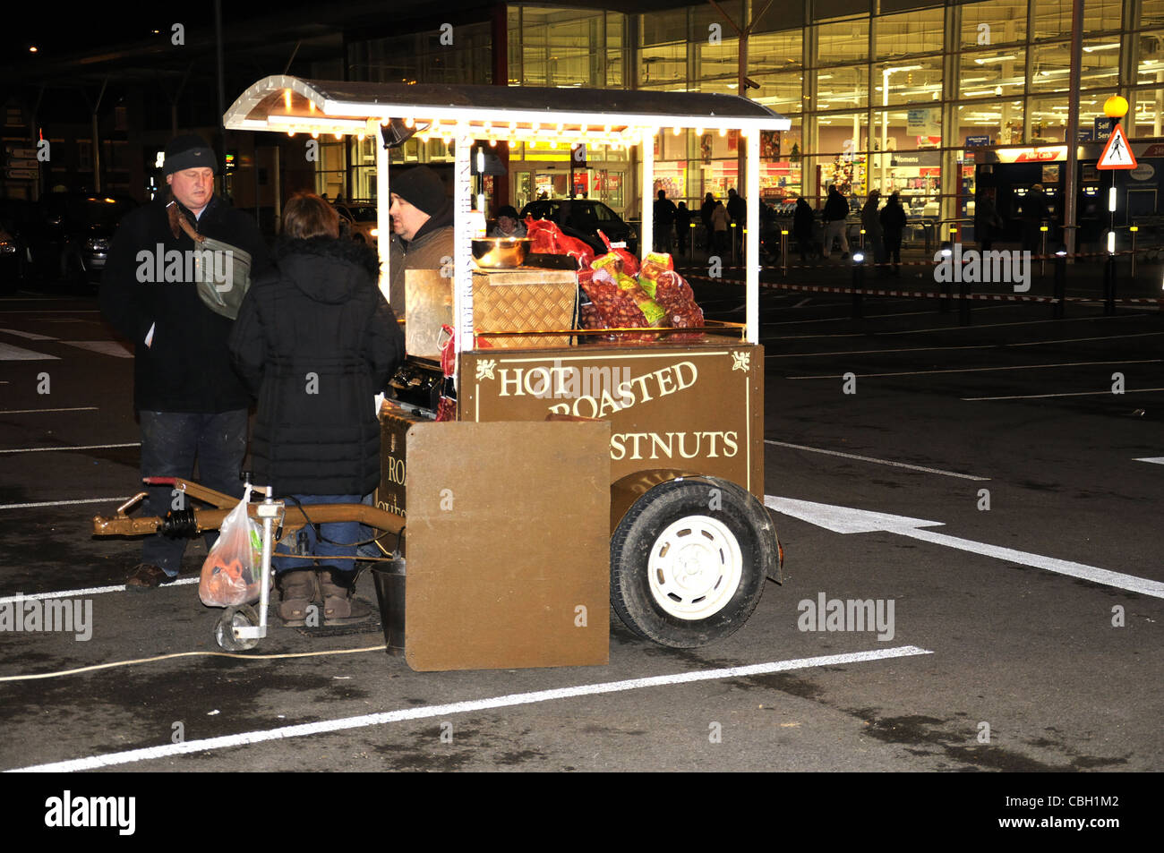 Roast chestnut stall at night Stock Photo - Alamy