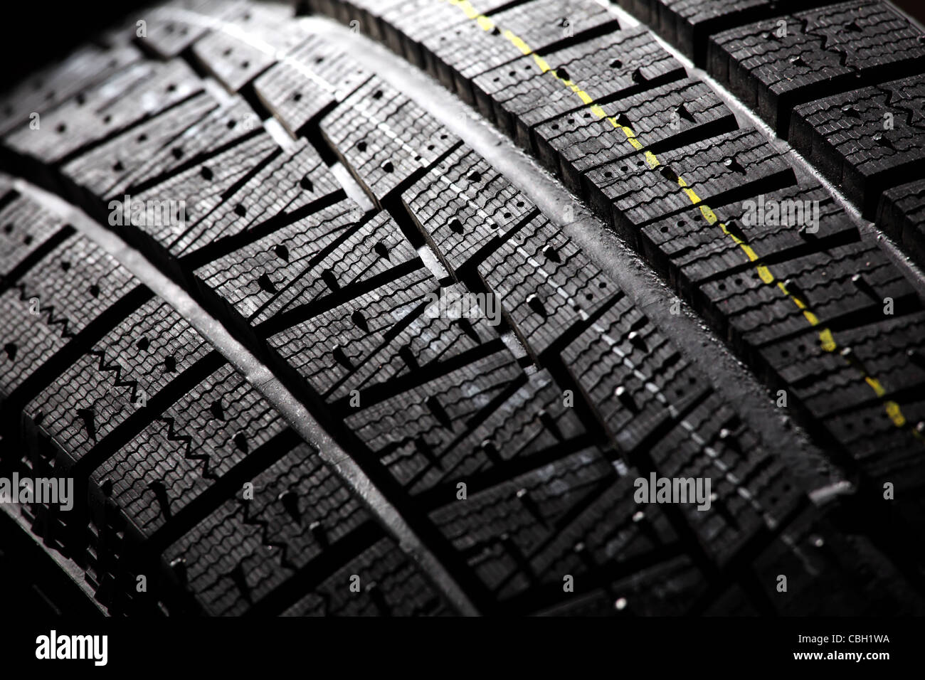 Part of brand new modern winter car tyre. Low key composition Stock ...