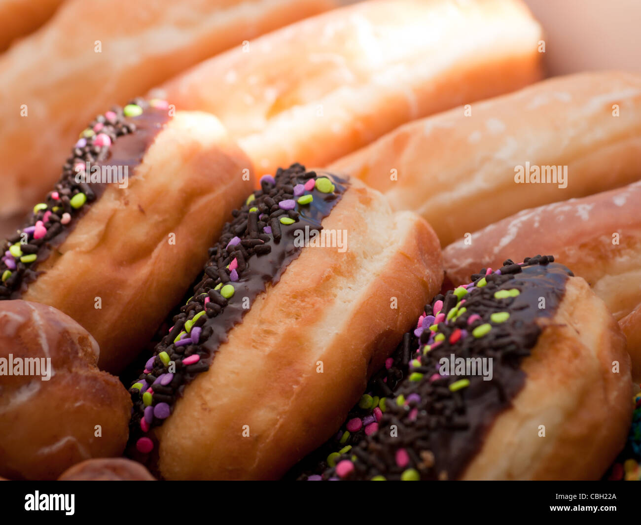Row of doughnuts on the display at the local farmers market Stock Photo ...