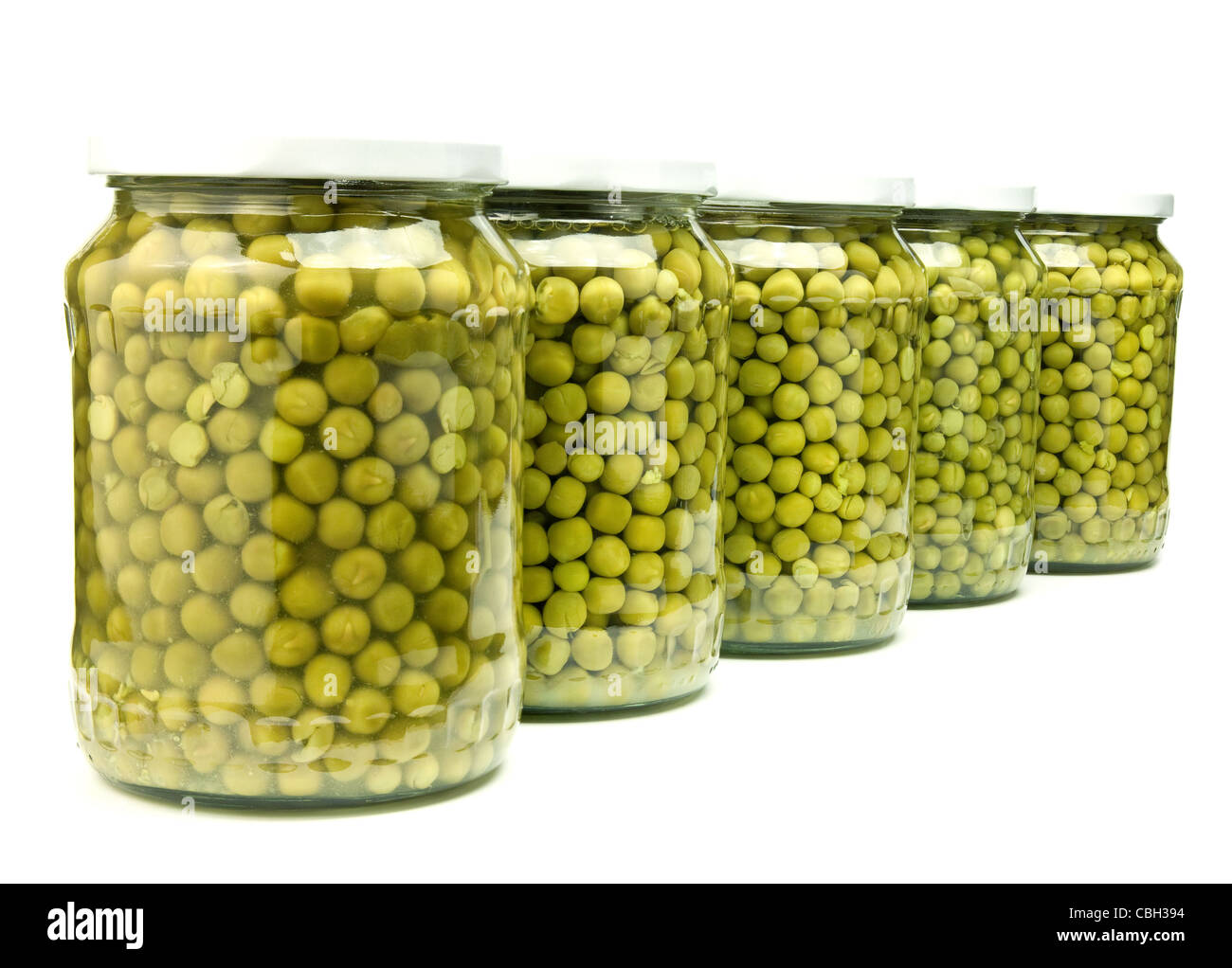 five jars of preserved green peas isolated on white Stock Photo - Alamy