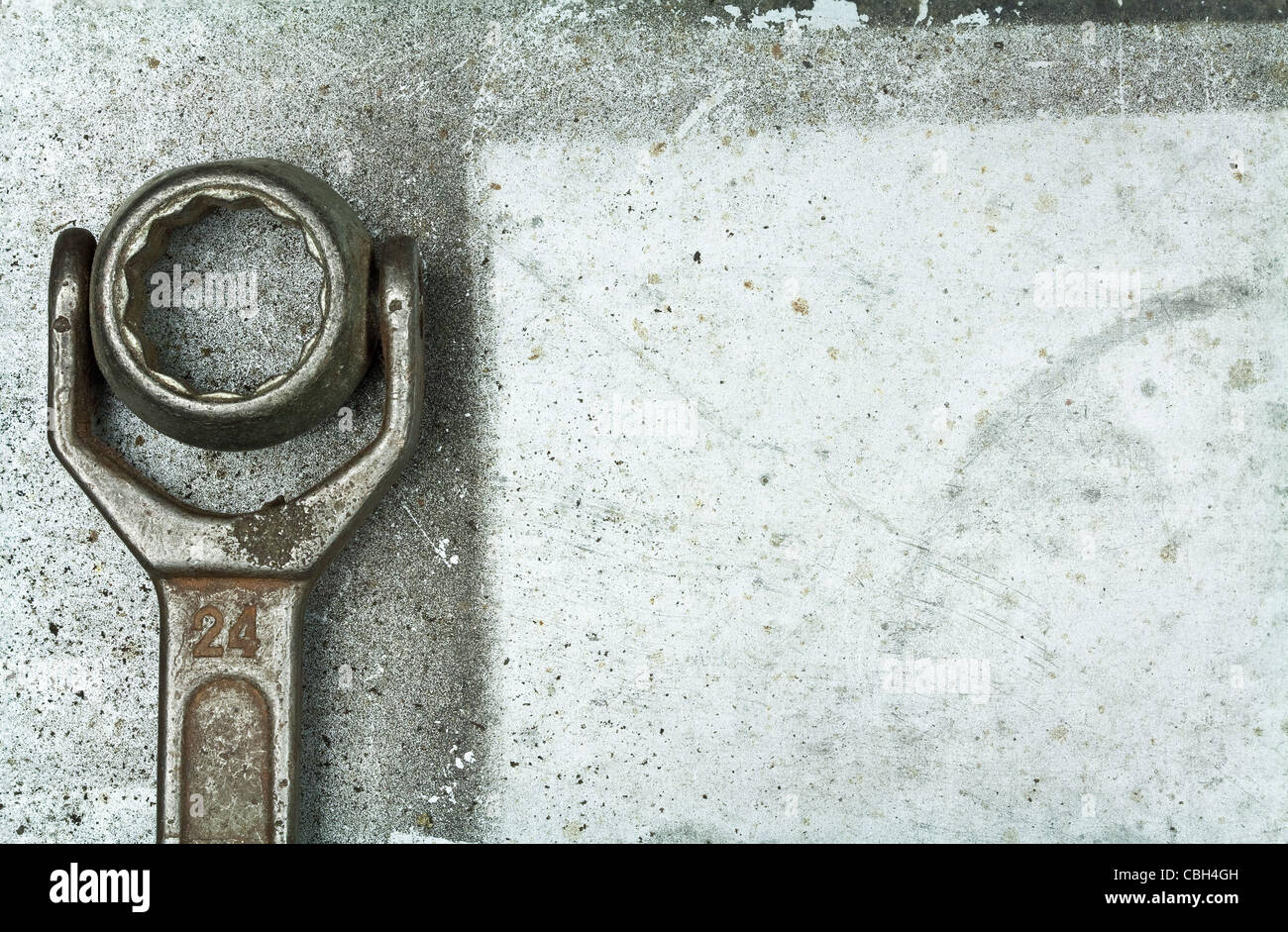 Old rusty wrench on metal background Stock Photo - Alamy