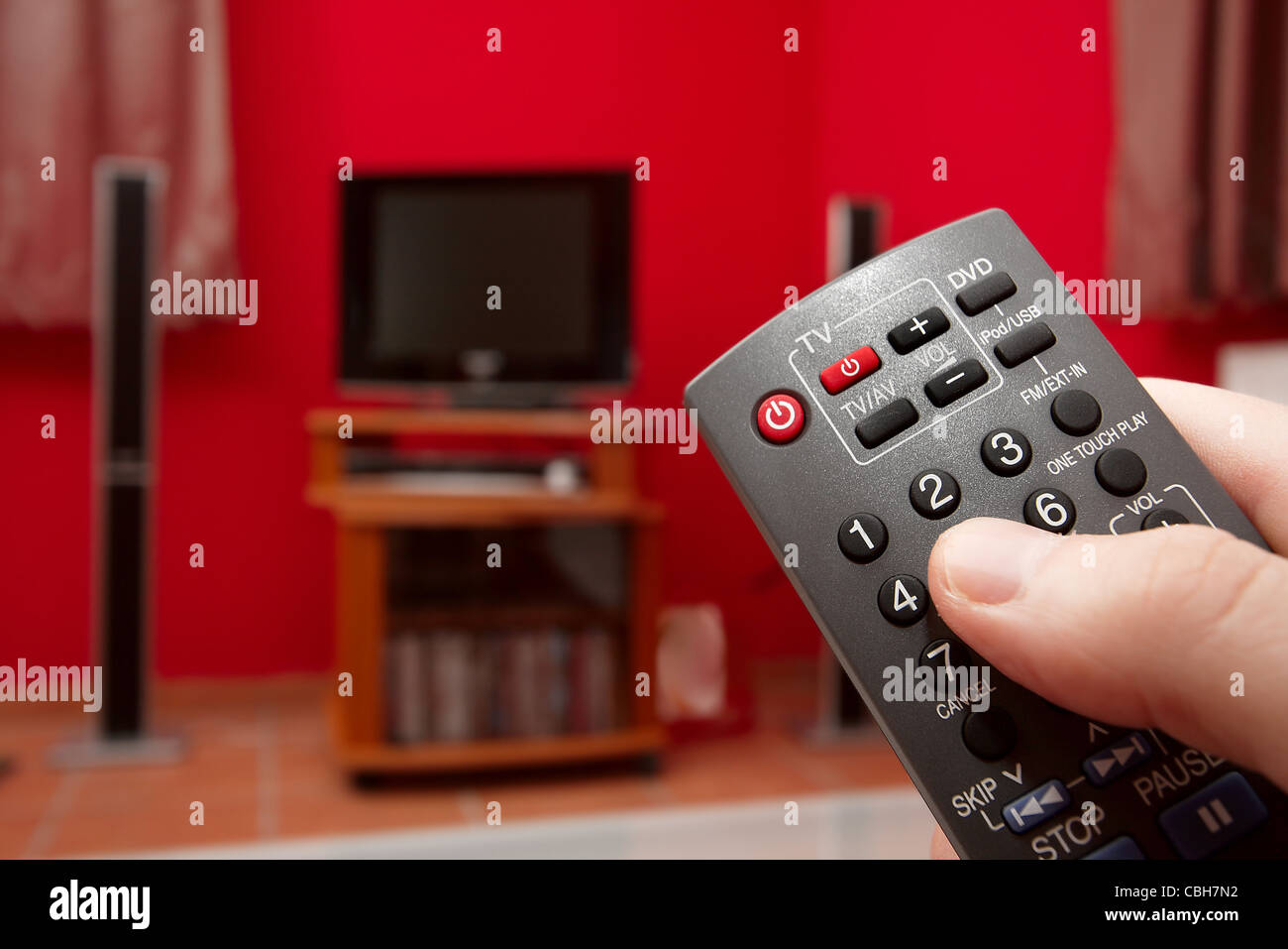 Closeup of a remote controller in human hand Stock Photo - Alamy
