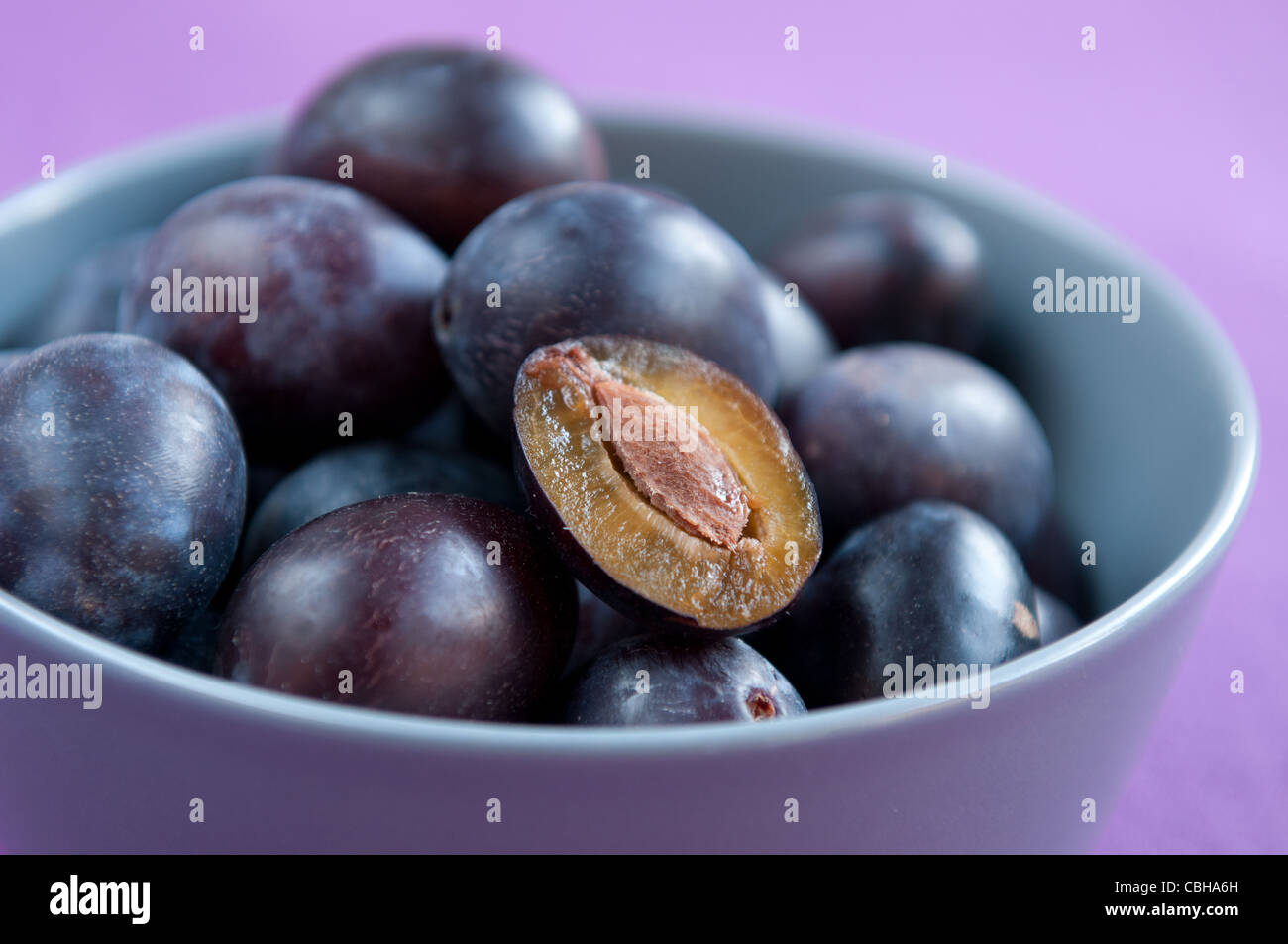 Group of fresh raw purple plums Stock Photo - Alamy