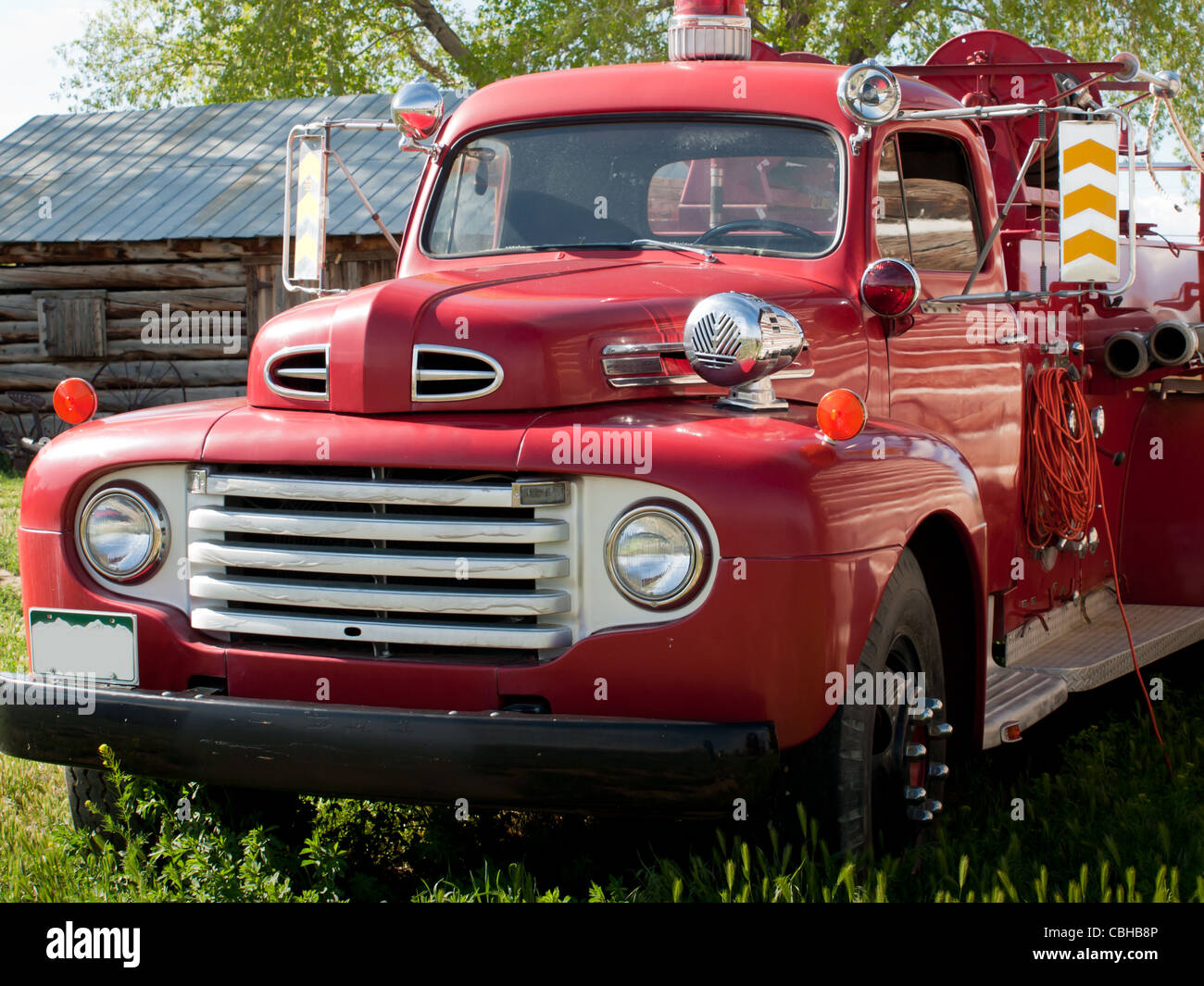 A mint-condition antique firetruck shines in the sun. Museum of the ...