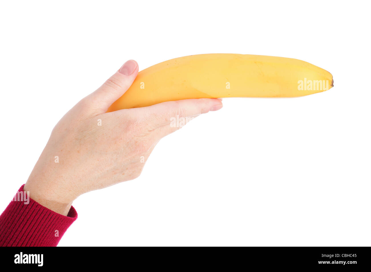 yellow banana in woman hand isolated on white background Stock Photo ...