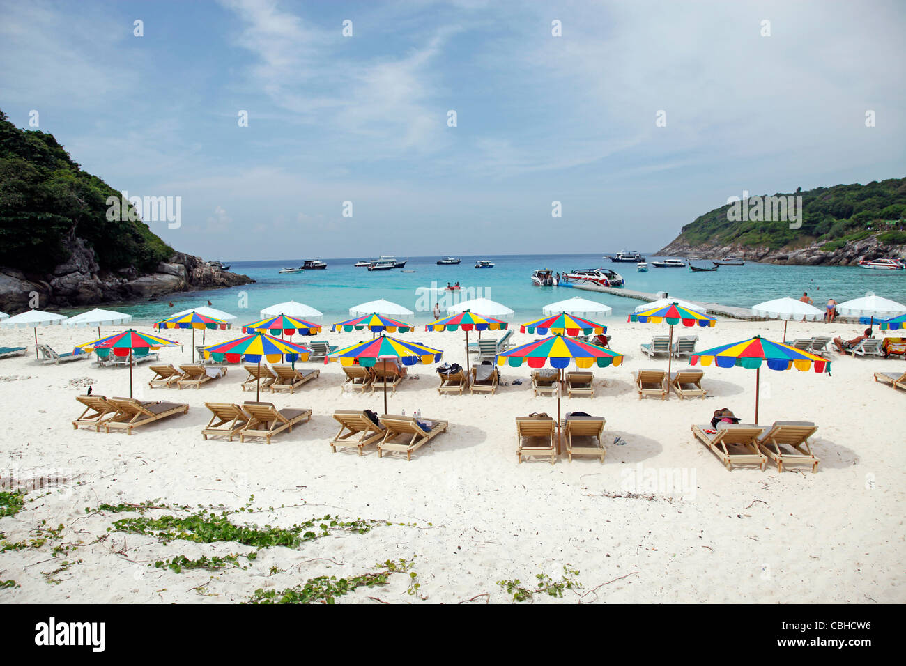 Sun loungers and beach umbrellas on the sandy holiday beaches of Patok ...