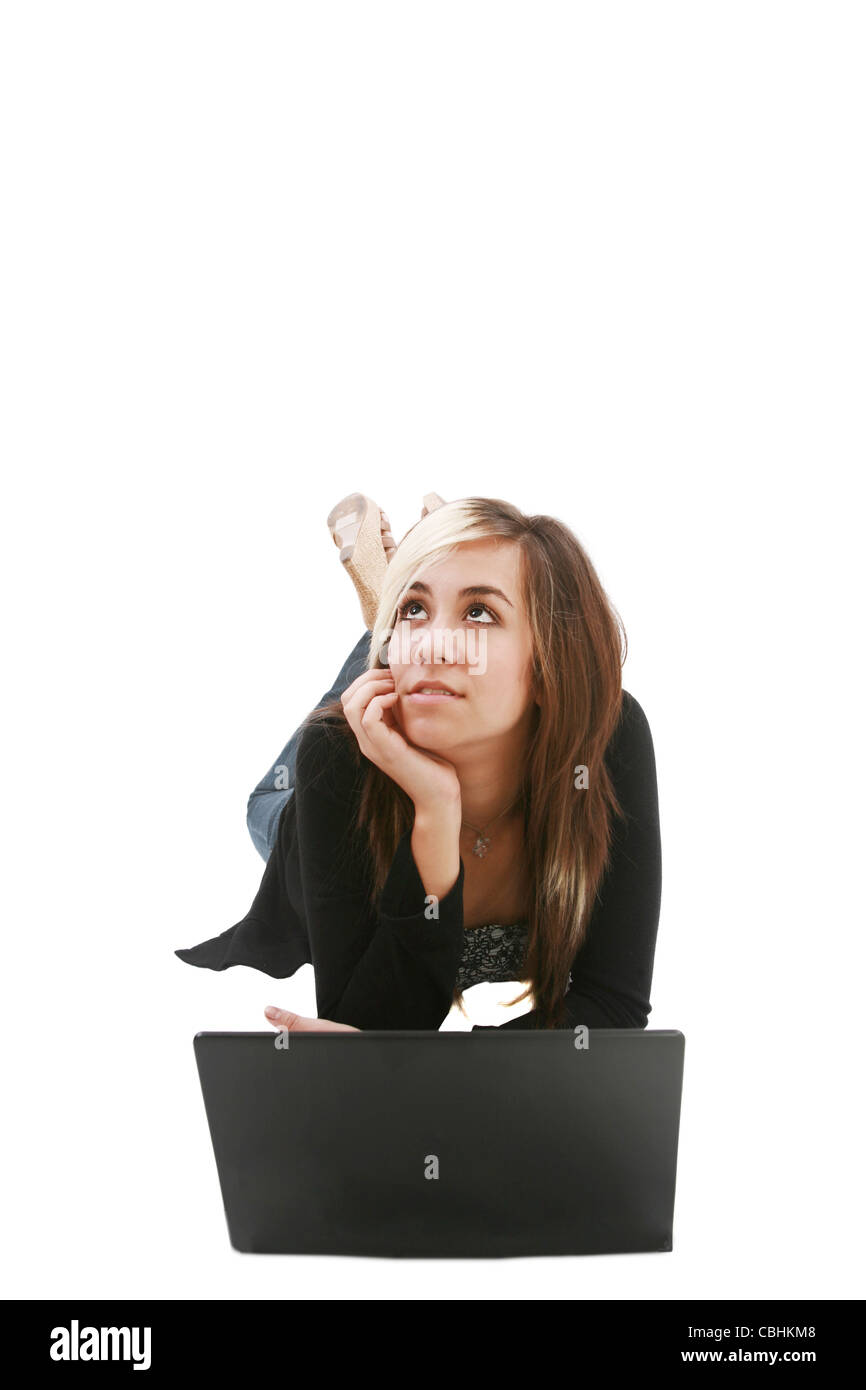 Girl with laptop on floor thinking about something Stock Photo - Alamy