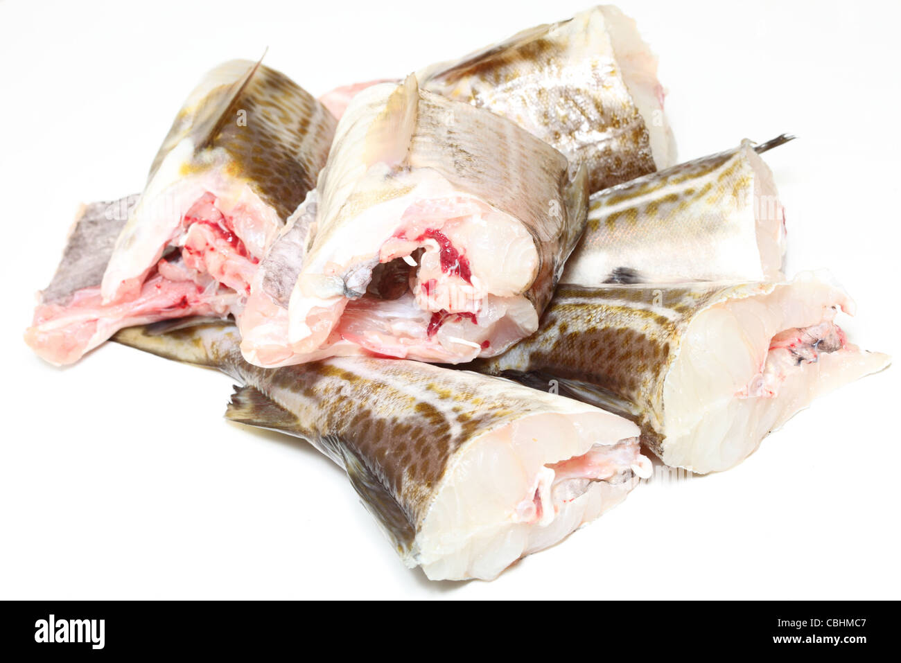 Raw cod fish fillets in kitchen on white background Stock Photo - Alamy