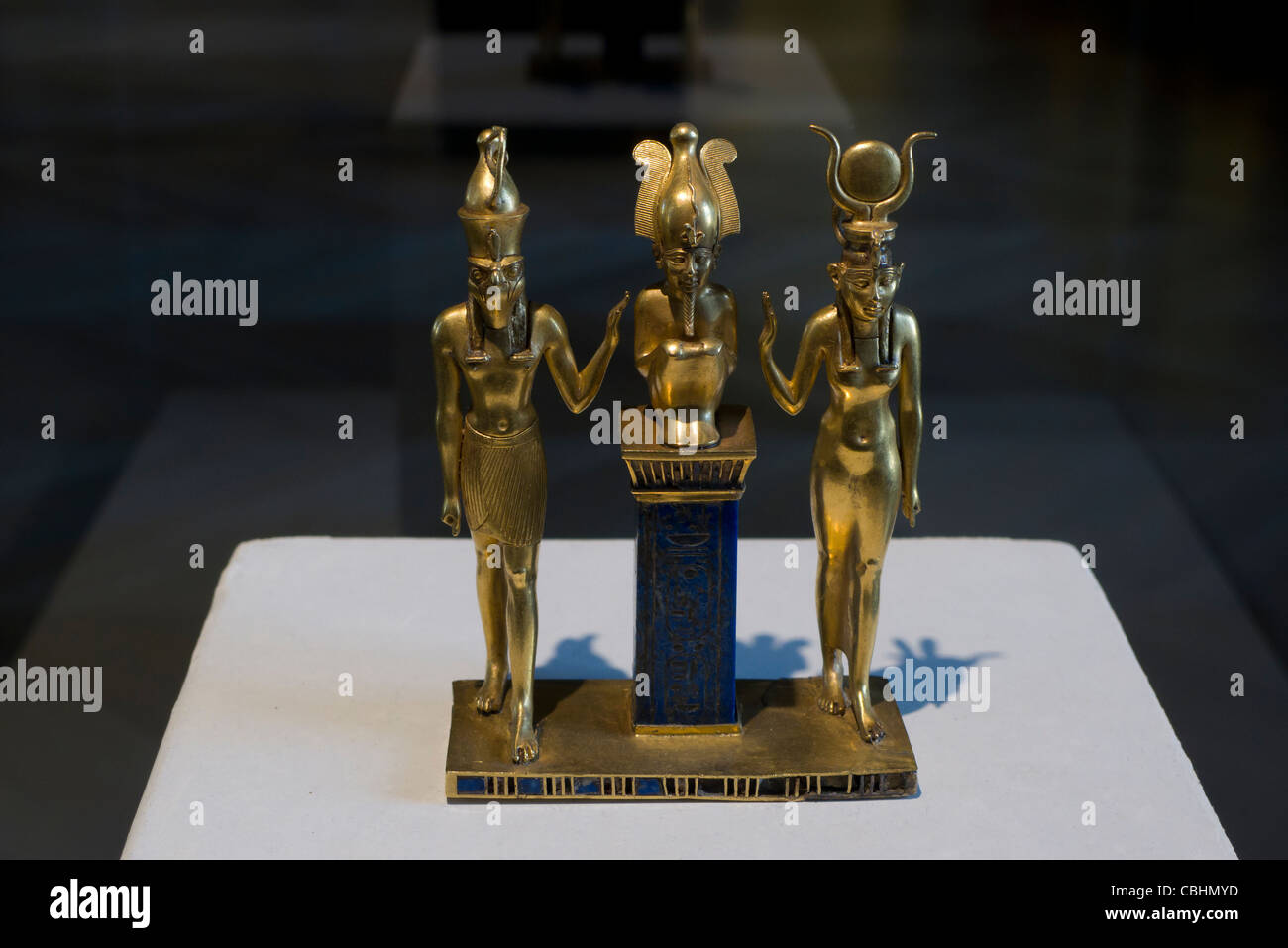 Osiris on a lapis lazuli pillar in the middle, Horus on the left and ...