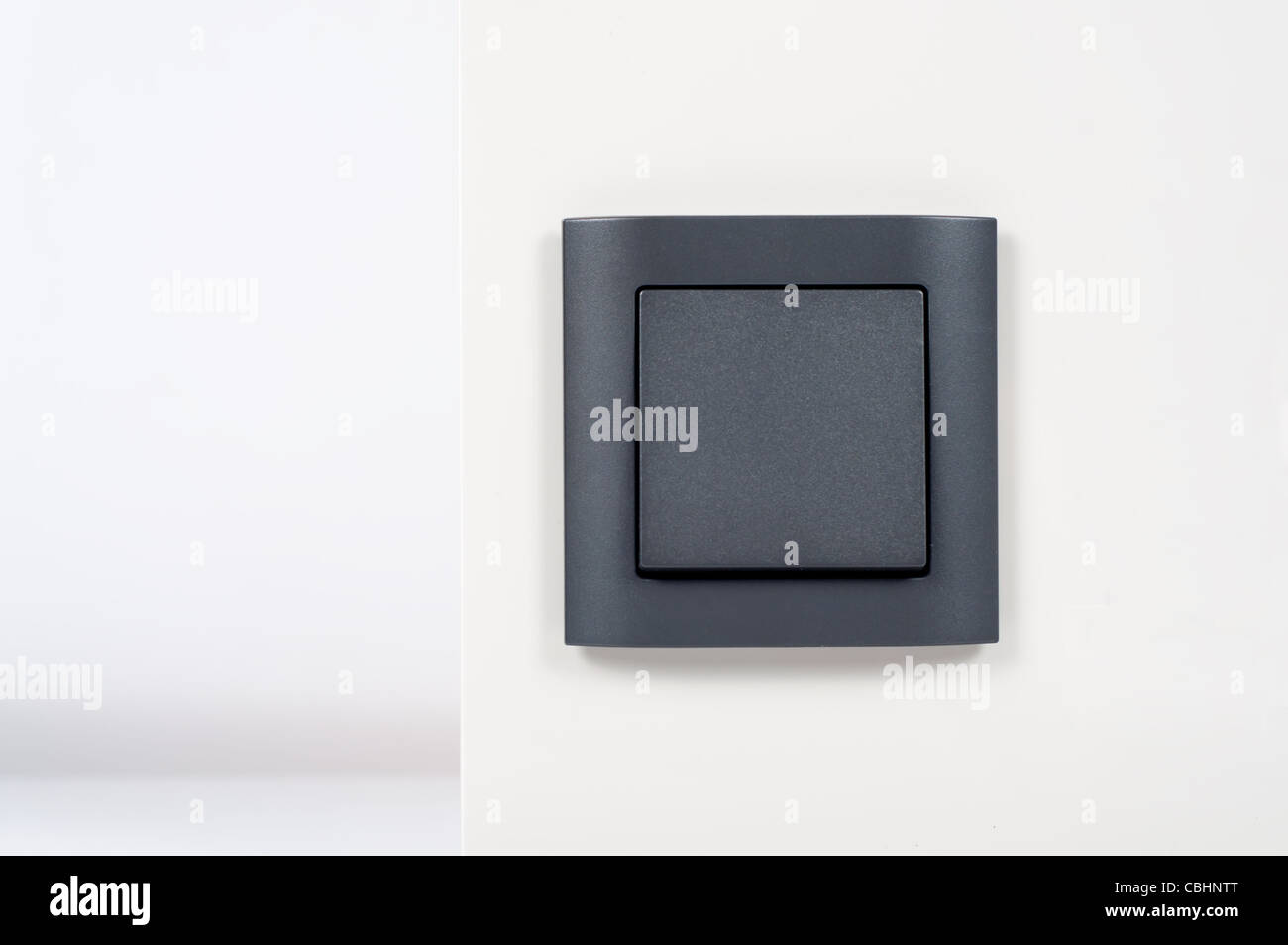 black light switch on the white wall Stock Photo - Alamy