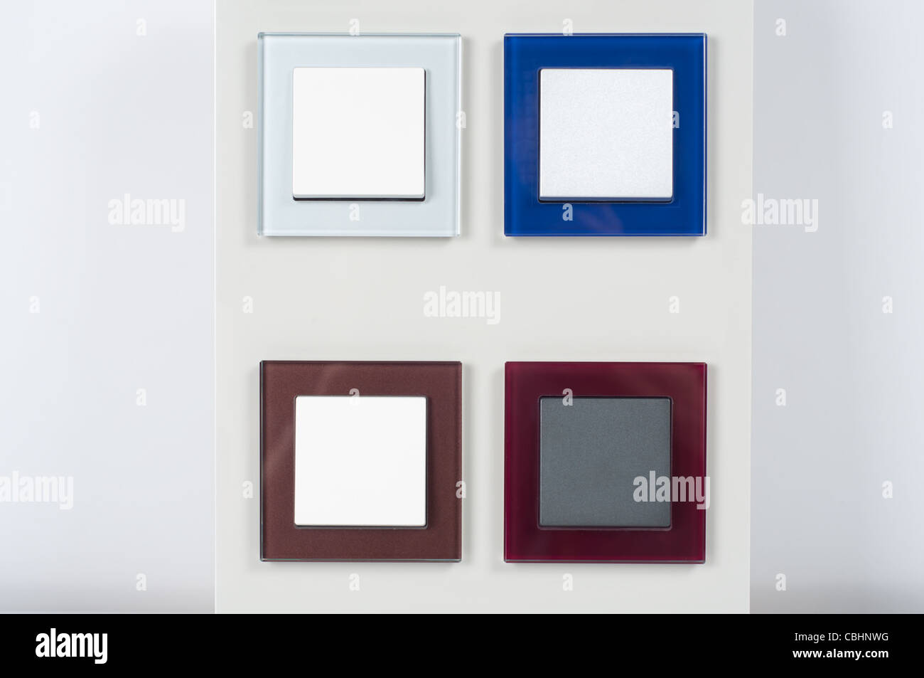 light switches on the wall with button on glass frame Stock Photo - Alamy