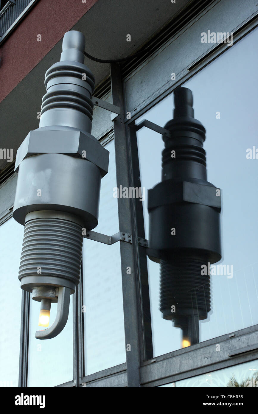Huge spark plug attached to an office block in Islington Stock Photo ...
