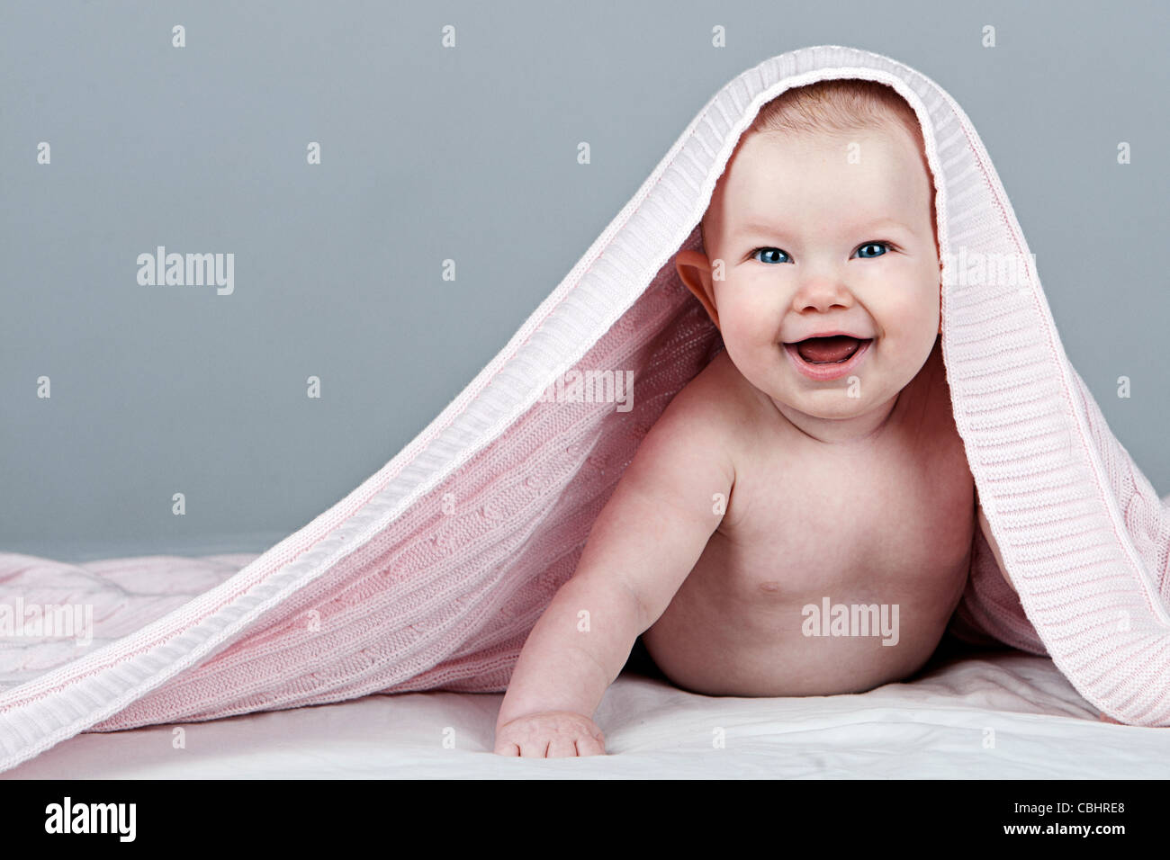 Beautiful Baby Girl Under Blanket Stock Photo - Alamy