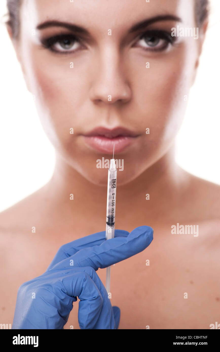 woman holding a syringe Stock Photo - Alamy