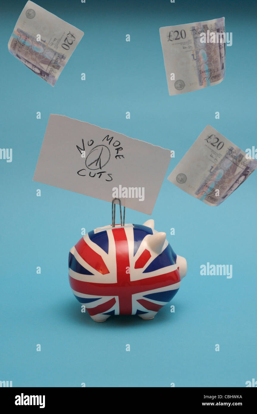 Money falling around a Union Jack Flag piggy bank against a blue ...