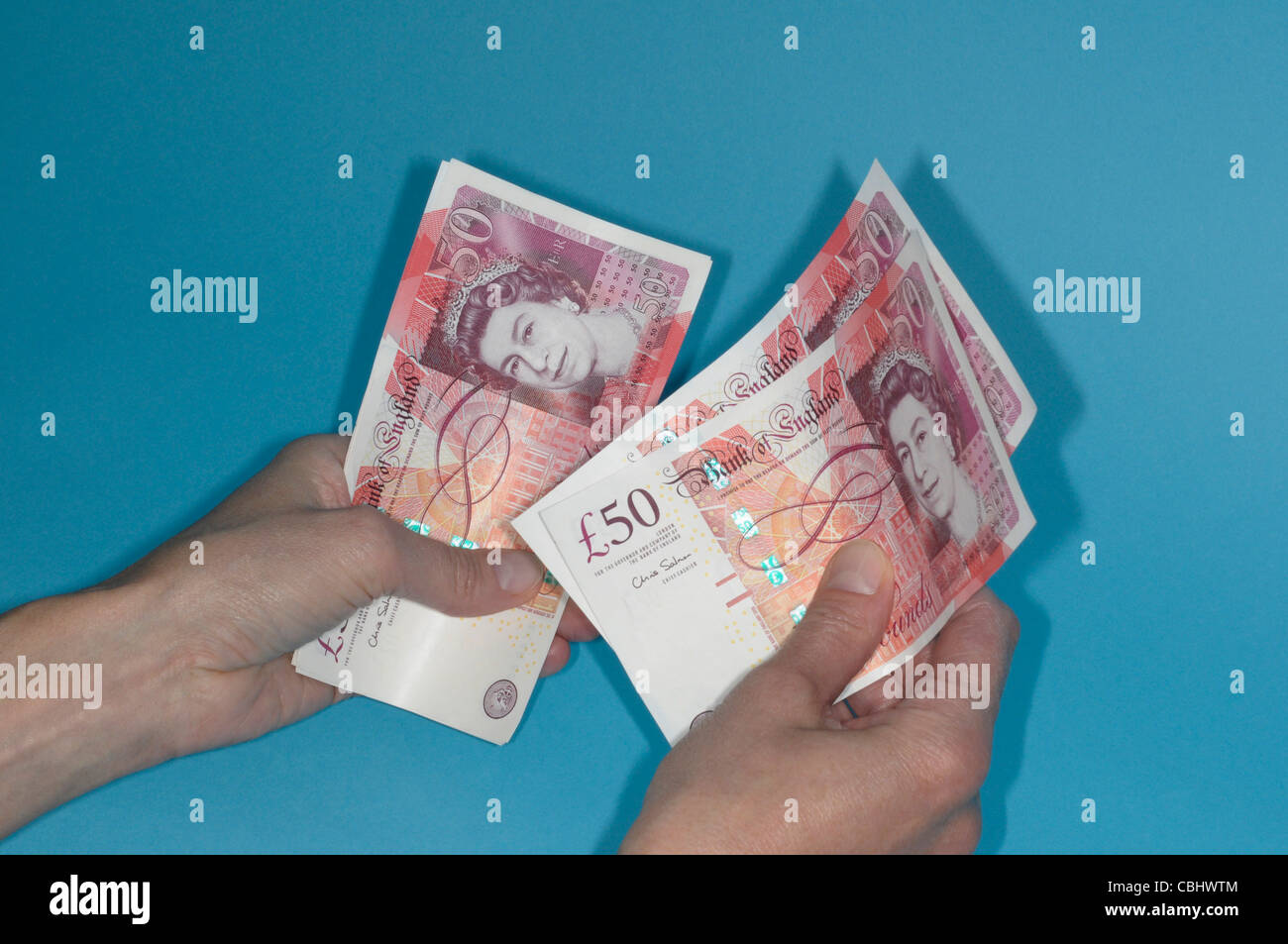 Counting fifty pound notes hi-res stock photography and images - Alamy