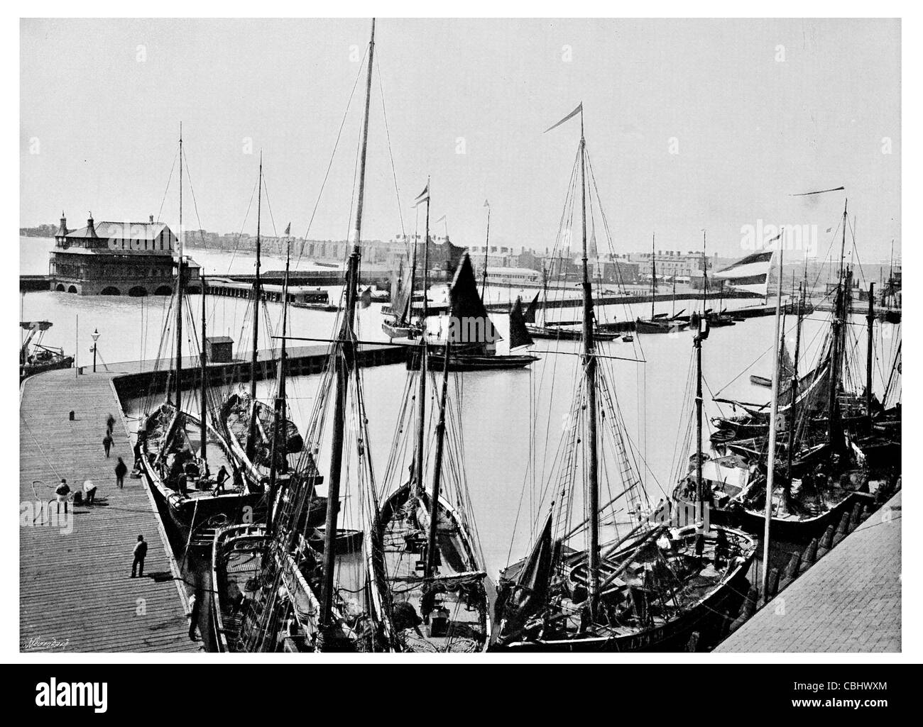 Lowestoft Harbour port dock quay fishing boat trawler sailing sail mast ...