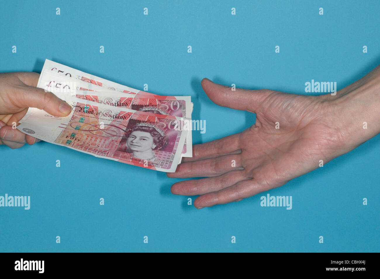 Debt Crisis. Savings and falling value of currencies. Hands passing ...