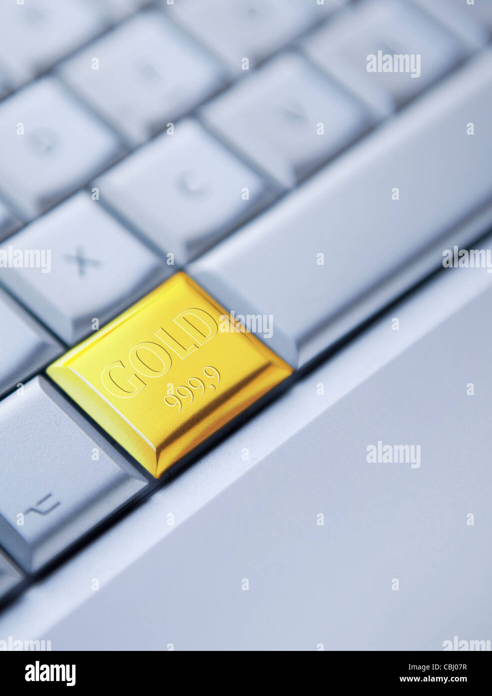 Buying Gold Online. Concept image of keyboard with one key depicted as ...