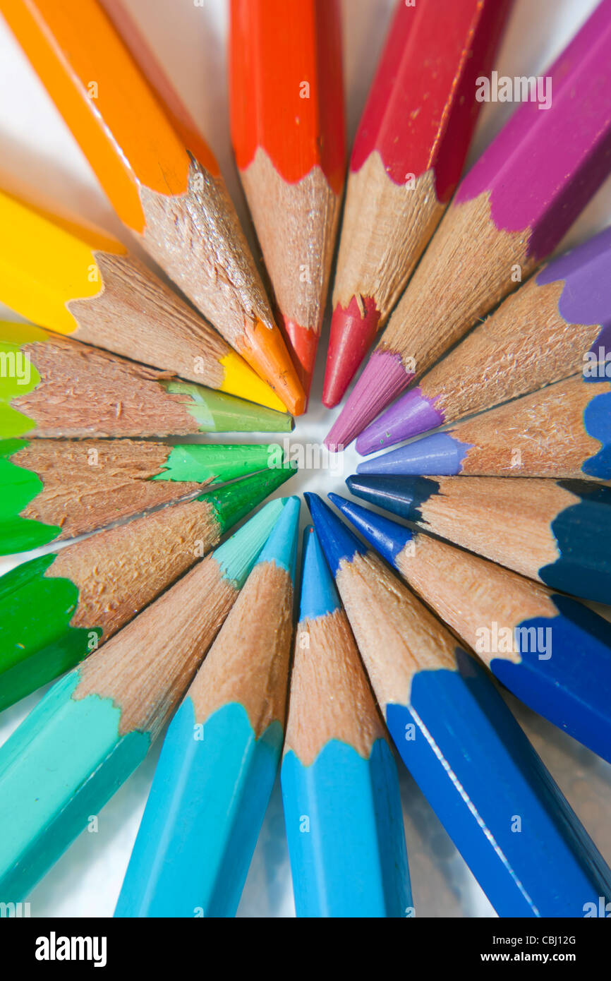 Color pencils in circle composition on white background Stock Photo - Alamy