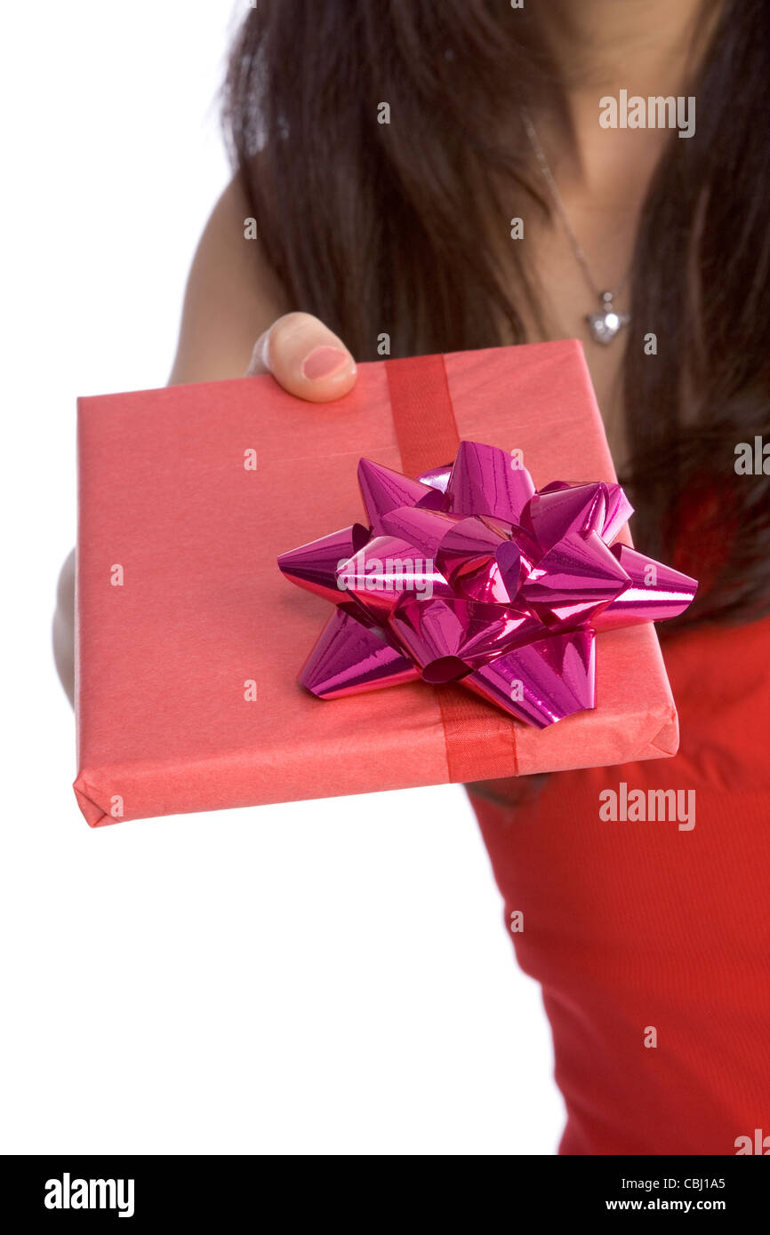 Close up of woman handing wrapped gift Stock Photo - Alamy