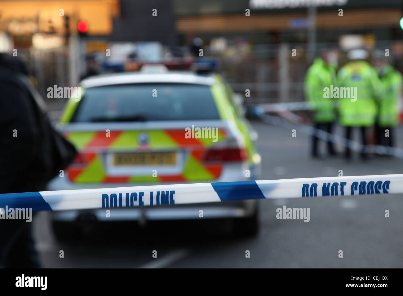 Police line with vehicle and crime investigation scene in background ...
