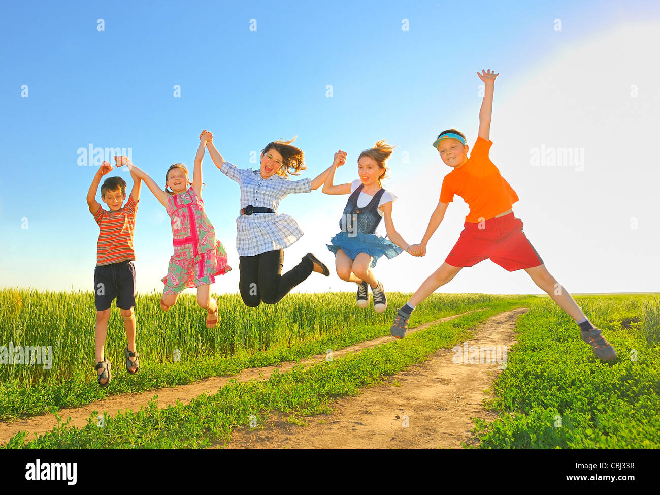 Kids jumping for joy hi-res stock photography and images - Alamy
