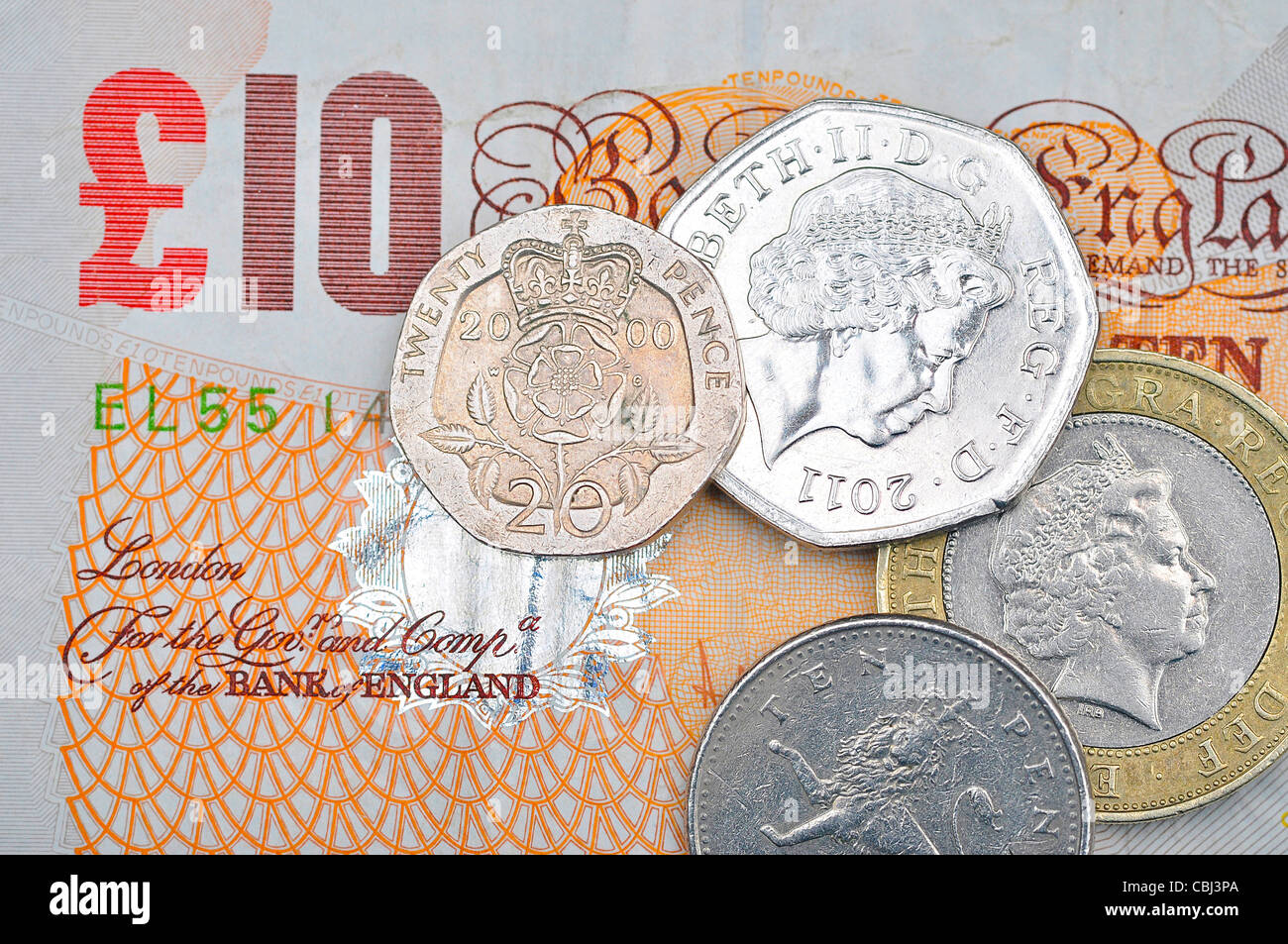 Money British ten Pound note and coins Stock Photo - Alamy